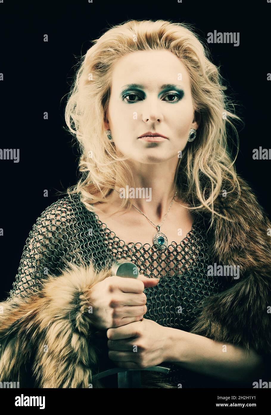 Valkyrie.Viking girl with sword Stock Photo - Alamy