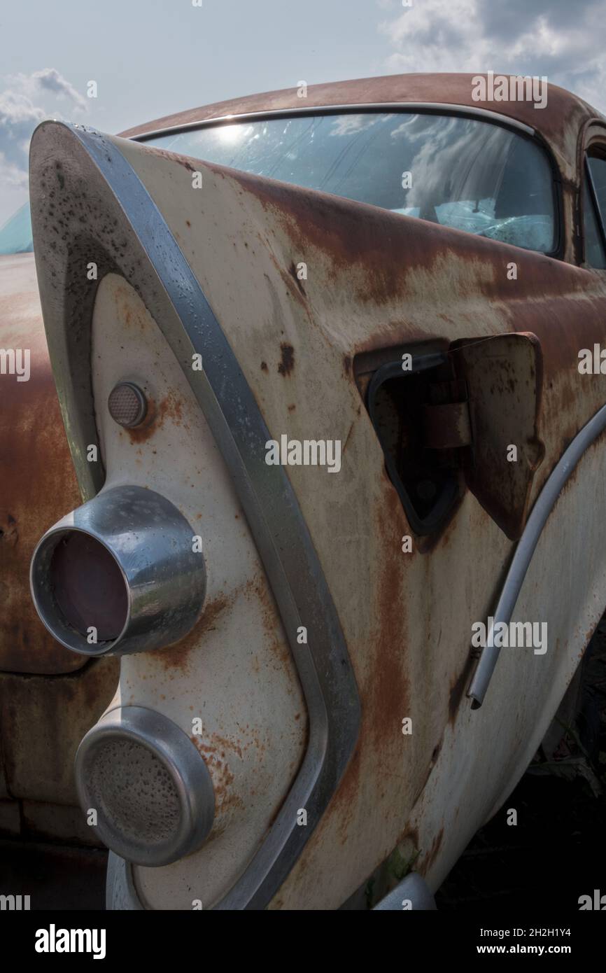 Rear of old rusted American car with distinctive fin Stock Photo - Alamy