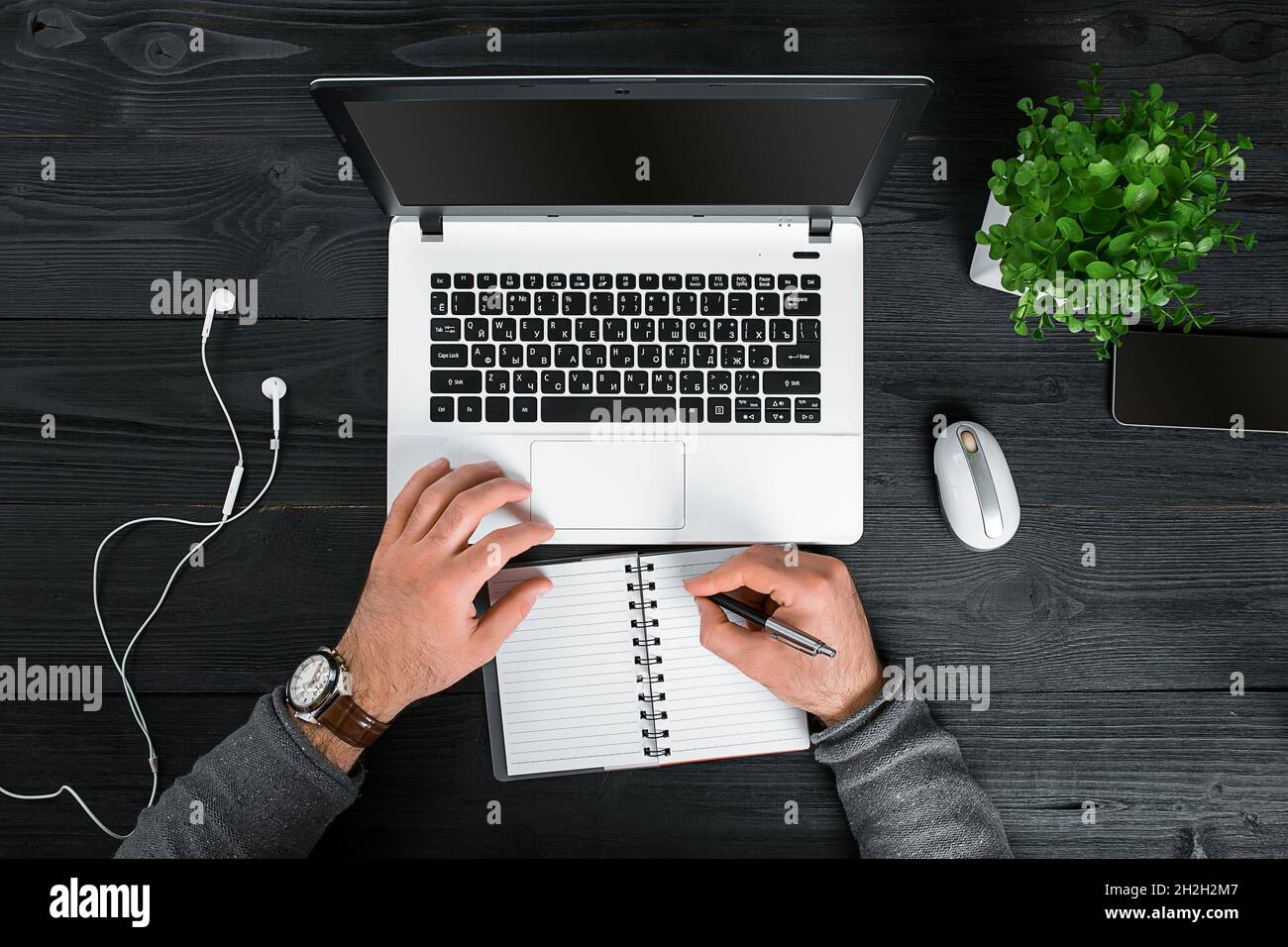 Directly above view of human hands typing on laptop Stock Photo - Alamy
