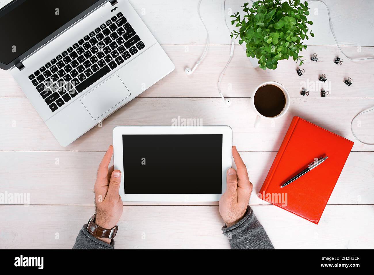 Directly above view of human hands typing on laptop Stock Photo - Alamy