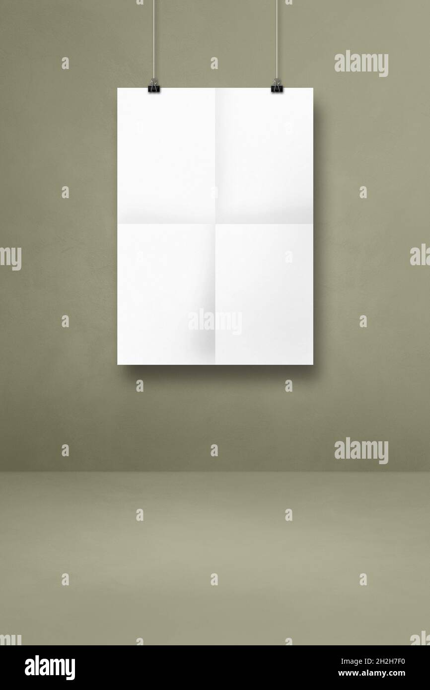White folded poster hanging on a grey wall with clips. Blank mockup ...