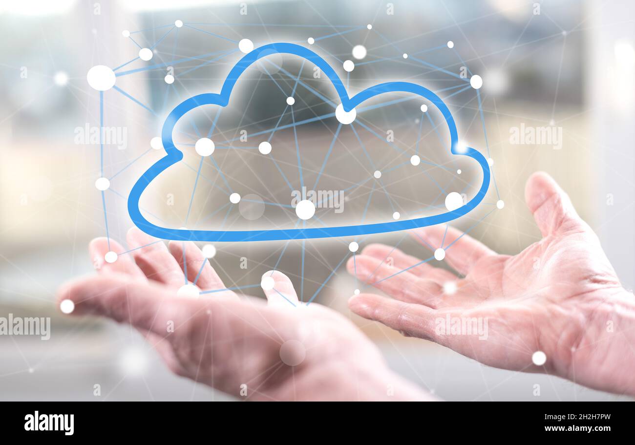 Cloud networking concept above the hands of a man Stock Photo - Alamy