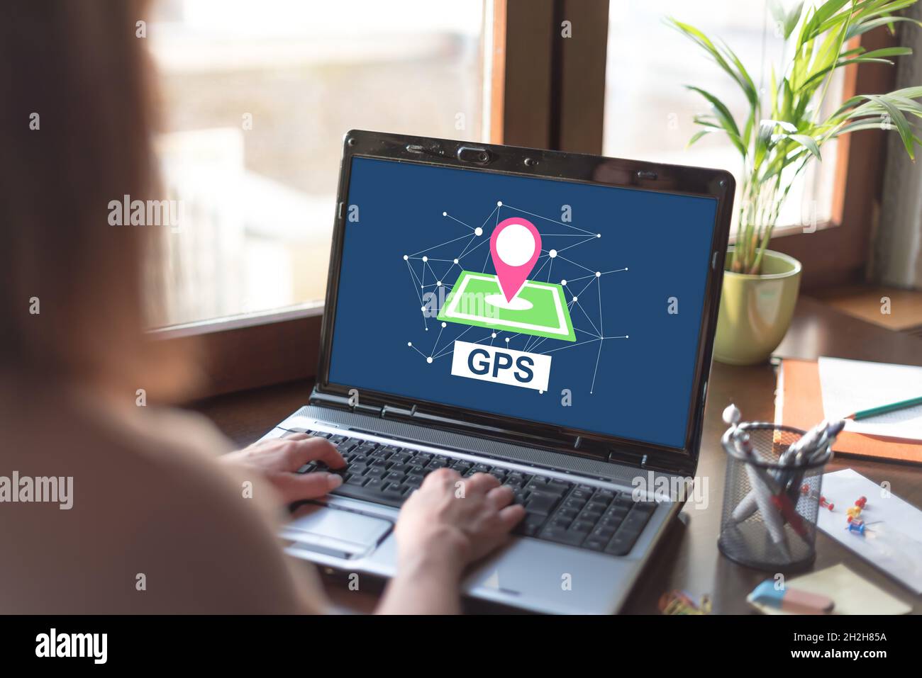 Laptop screen displaying a gps concept Stock Photo - Alamy