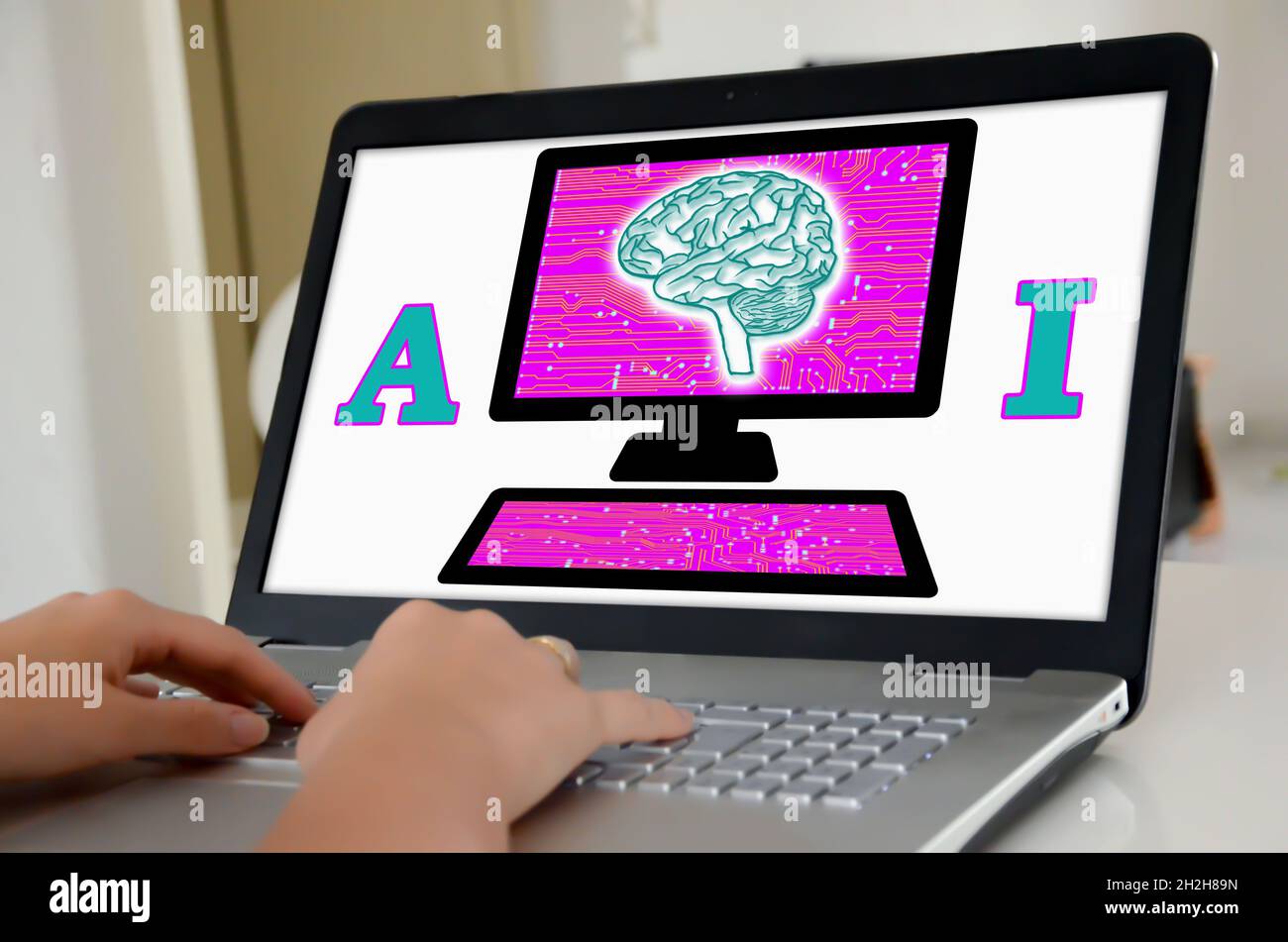 Hands on a laptop with screen showing artificial intelligence concept ...