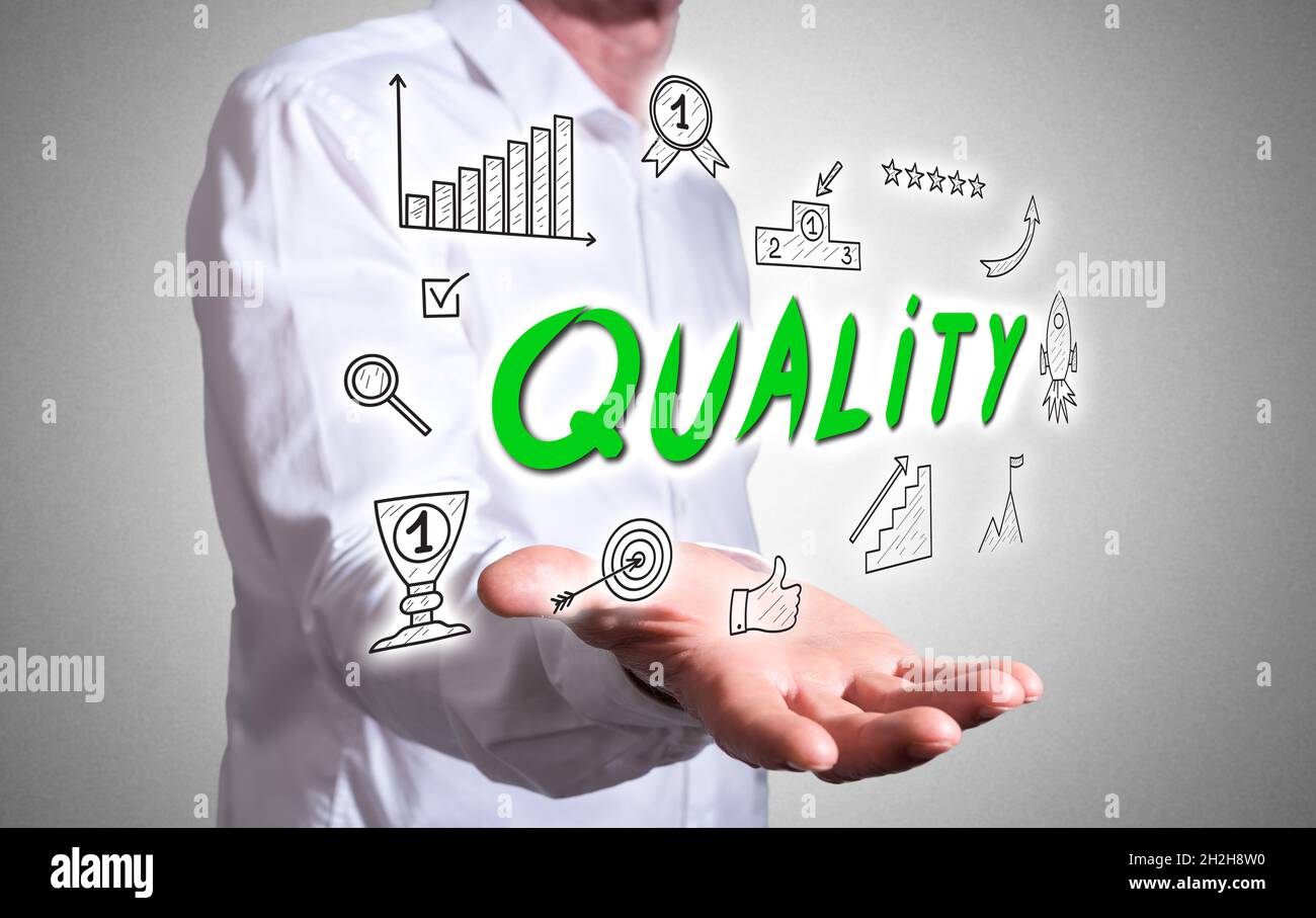 Quality concept levitating above a human hand Stock Photo - Alamy