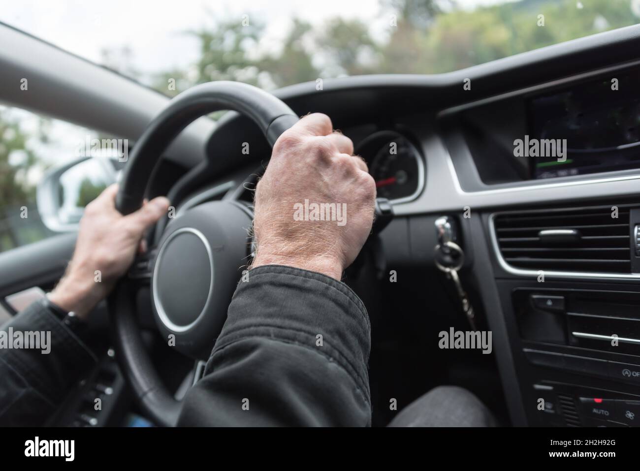 Car driving with both hands on the wheel Stock Photo - Alamy