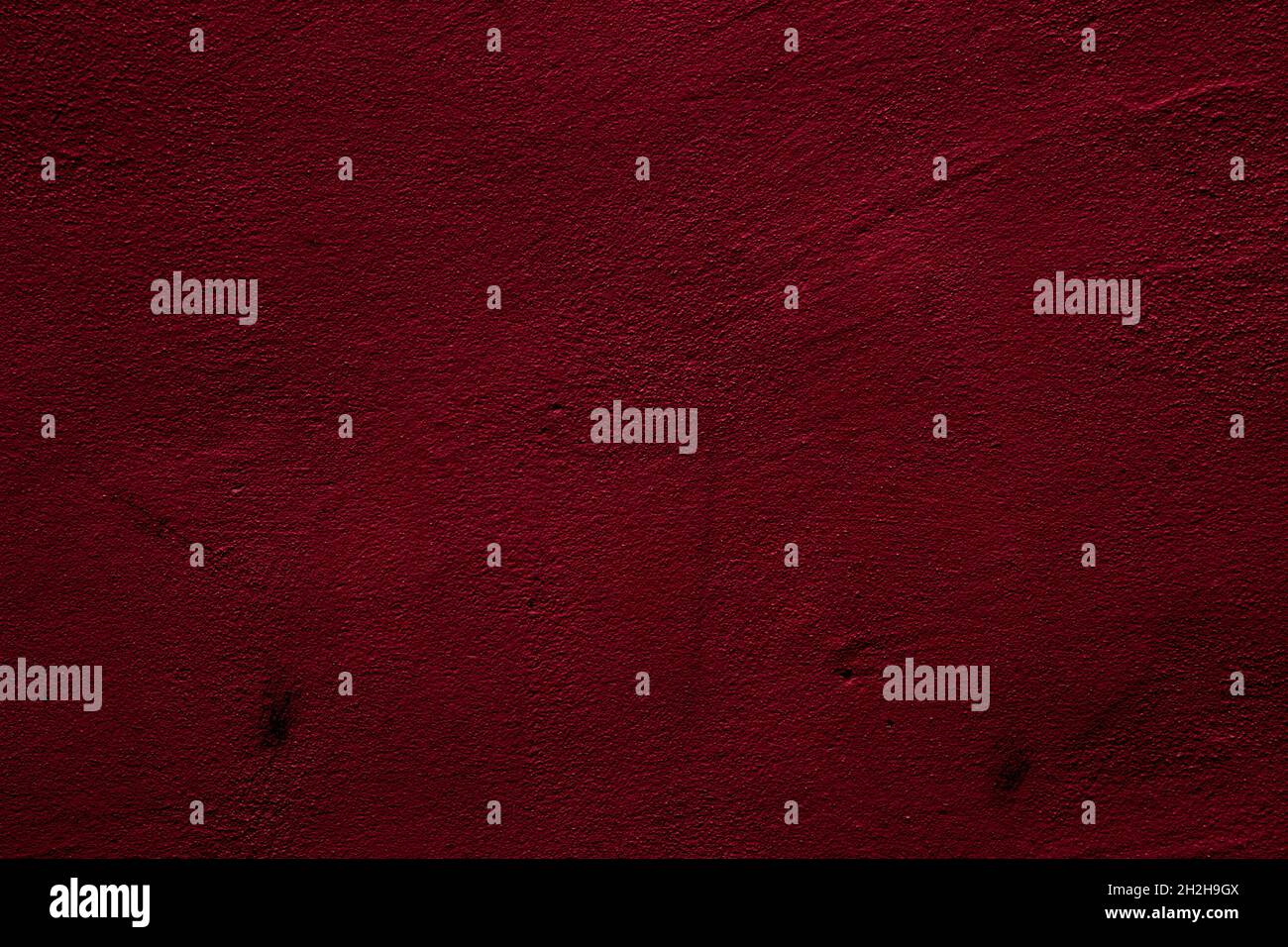 Crimson colored wall background with textures of different shades of ...