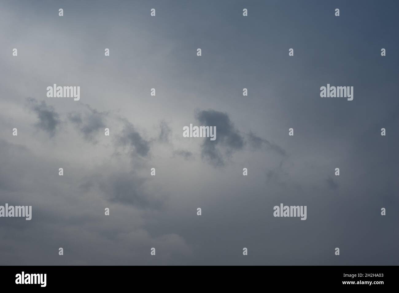 Gray cloudy sky with beautiful sunlight backlit clouds. A natural ...