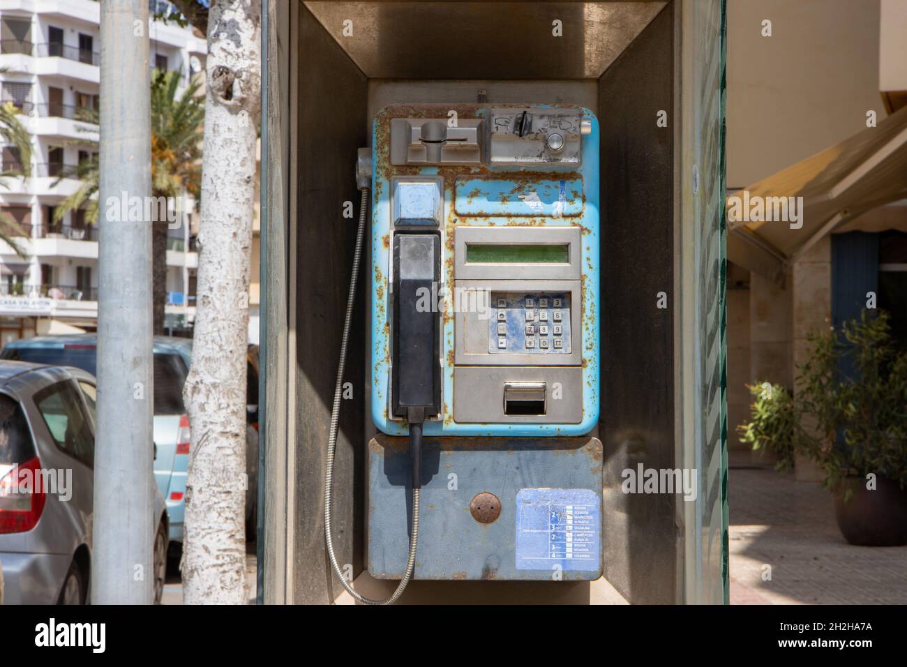 An original style telephone box in the streets of Ibiza on the Spanish ...