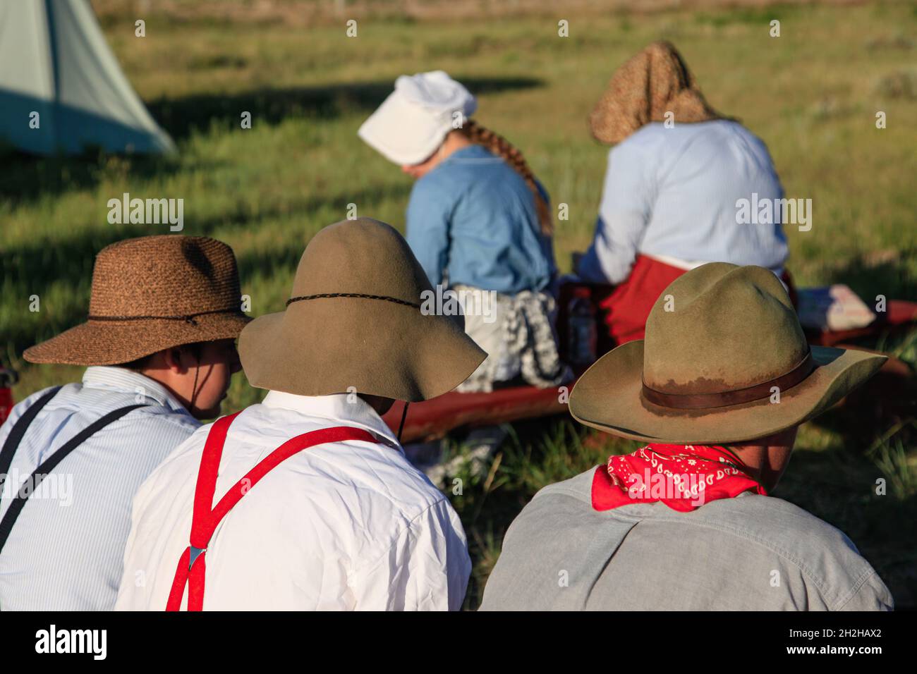 Teenage boys in pioneer drees re-enact a Mormon pioneer handcart trek ...