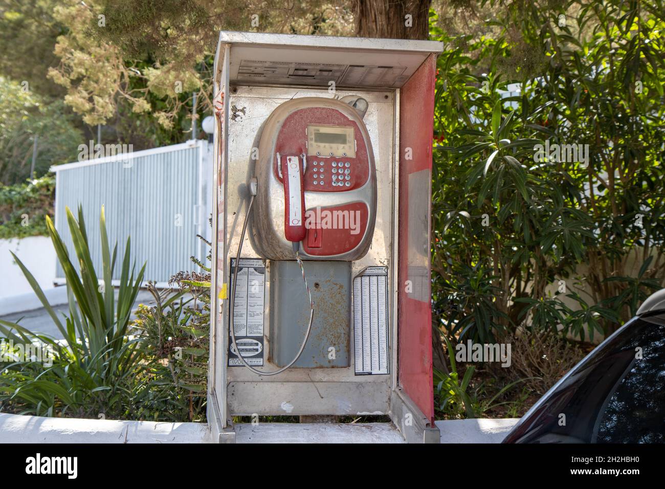 An original style telephone box in the streets of Ibiza on the Spanish ...