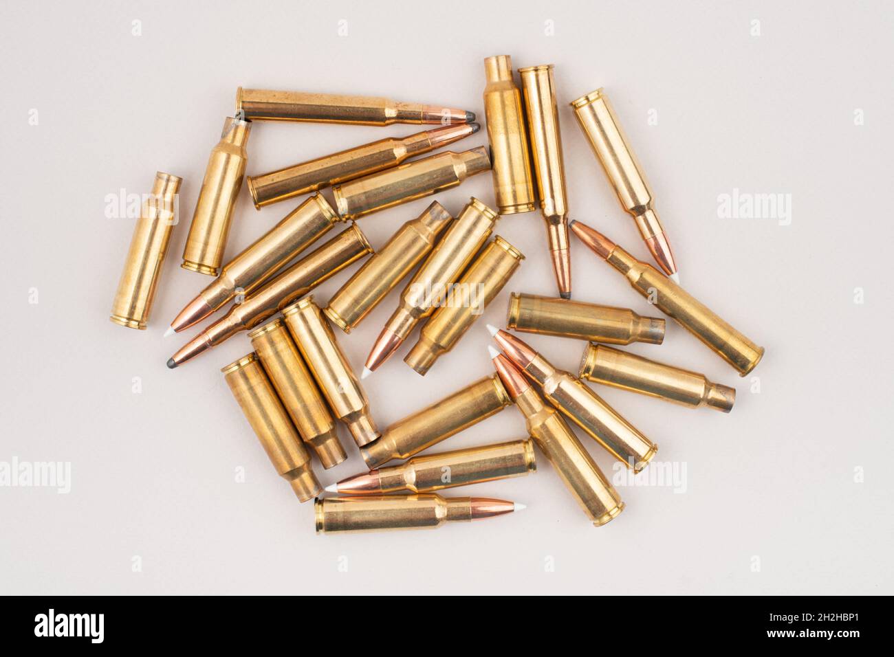 Pile of rifle bullets isolated on grey background. Top view Stock Photo ...