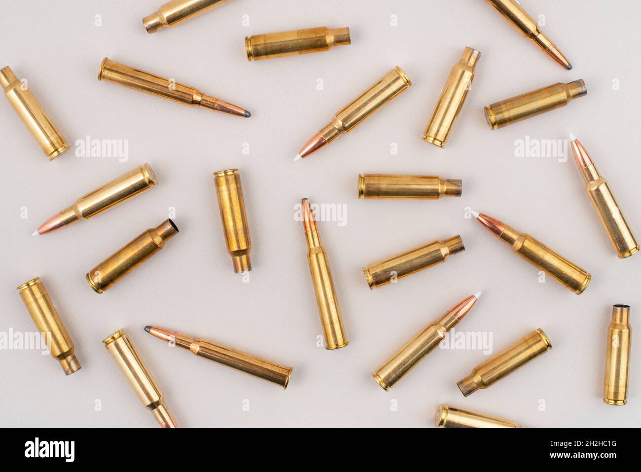 Pile of rifle bullets isolated on grey background. Top view Stock Photo ...