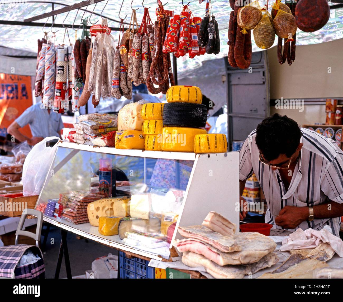 Cooked meat and cheese market stall, Albox, Spain Stock Photo - Alamy