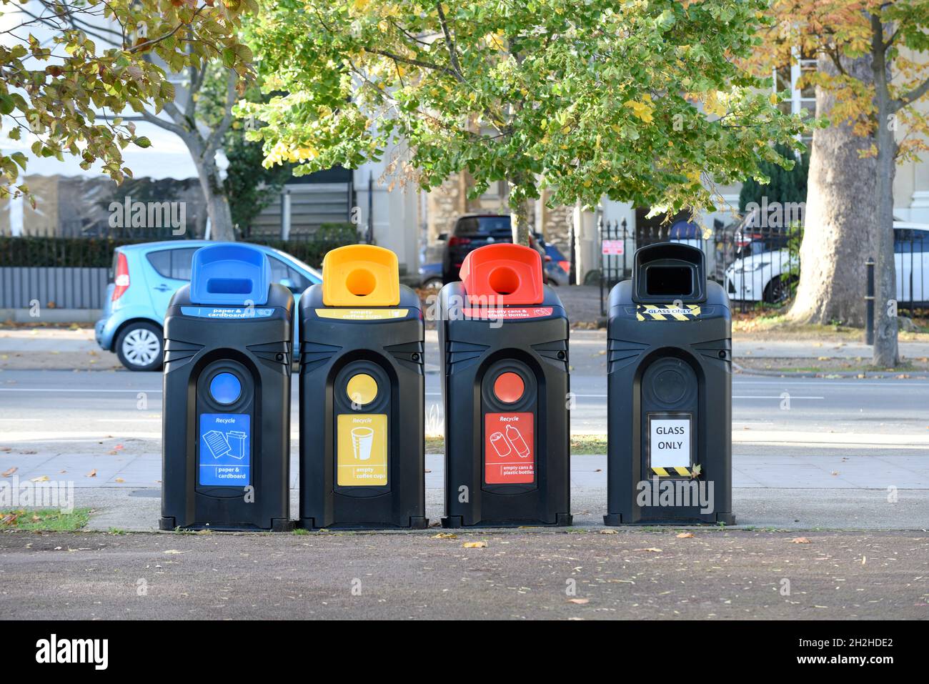 Recycling bins on a street for people to recycle waste when out in ...