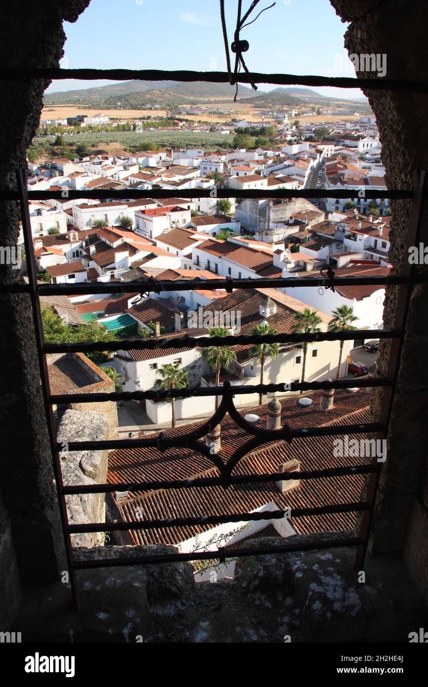 Vertical shot of a beautiful small town taken from the window of an old ...