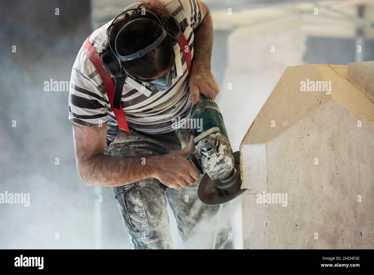 sculptor cuts marble with machine Stock Photo - Alamy