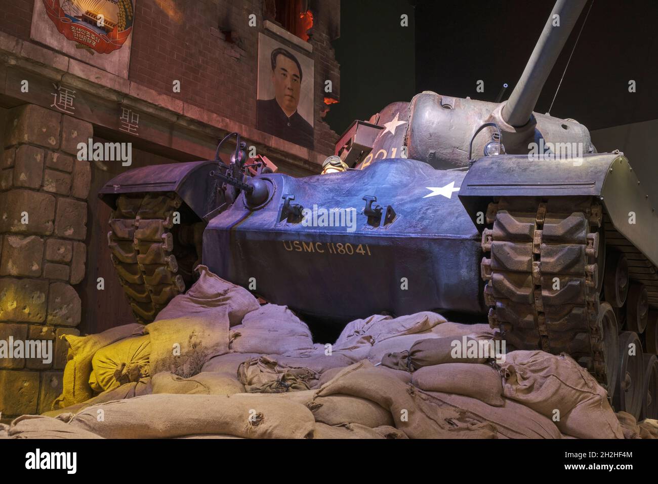 A Pershing M26 tank in a city street during the Korean War. At the ...