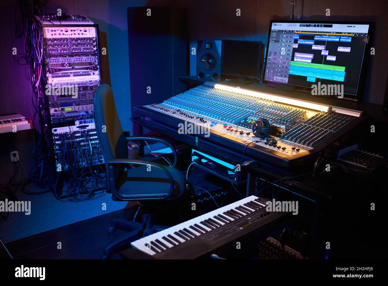 Image of modern dark recording studio with computer and musical ...