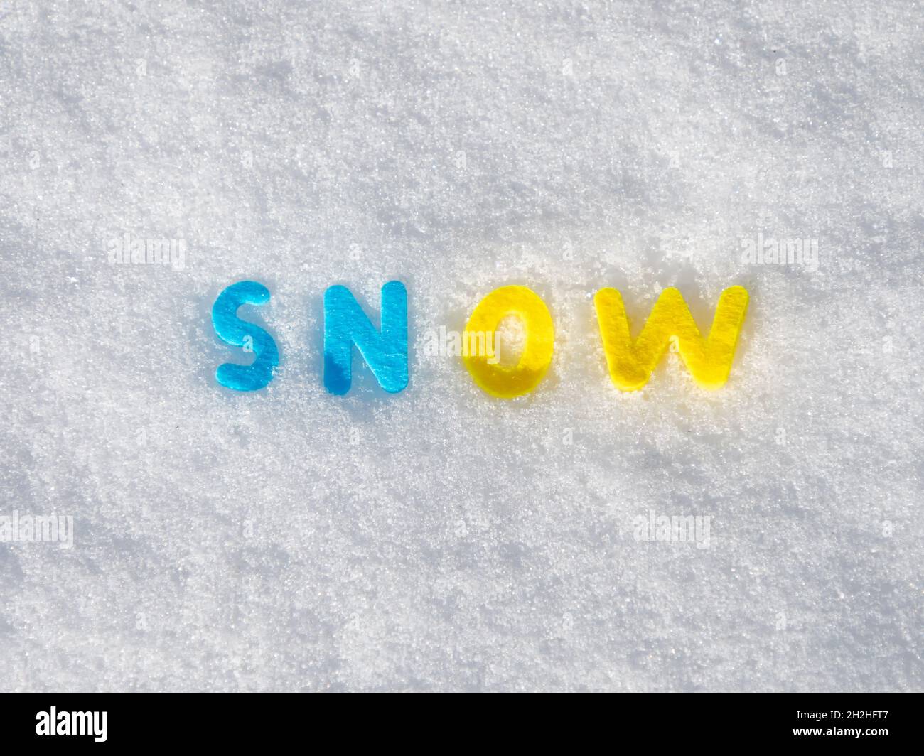 Color lettering Snow on snow Stock Photo - Alamy