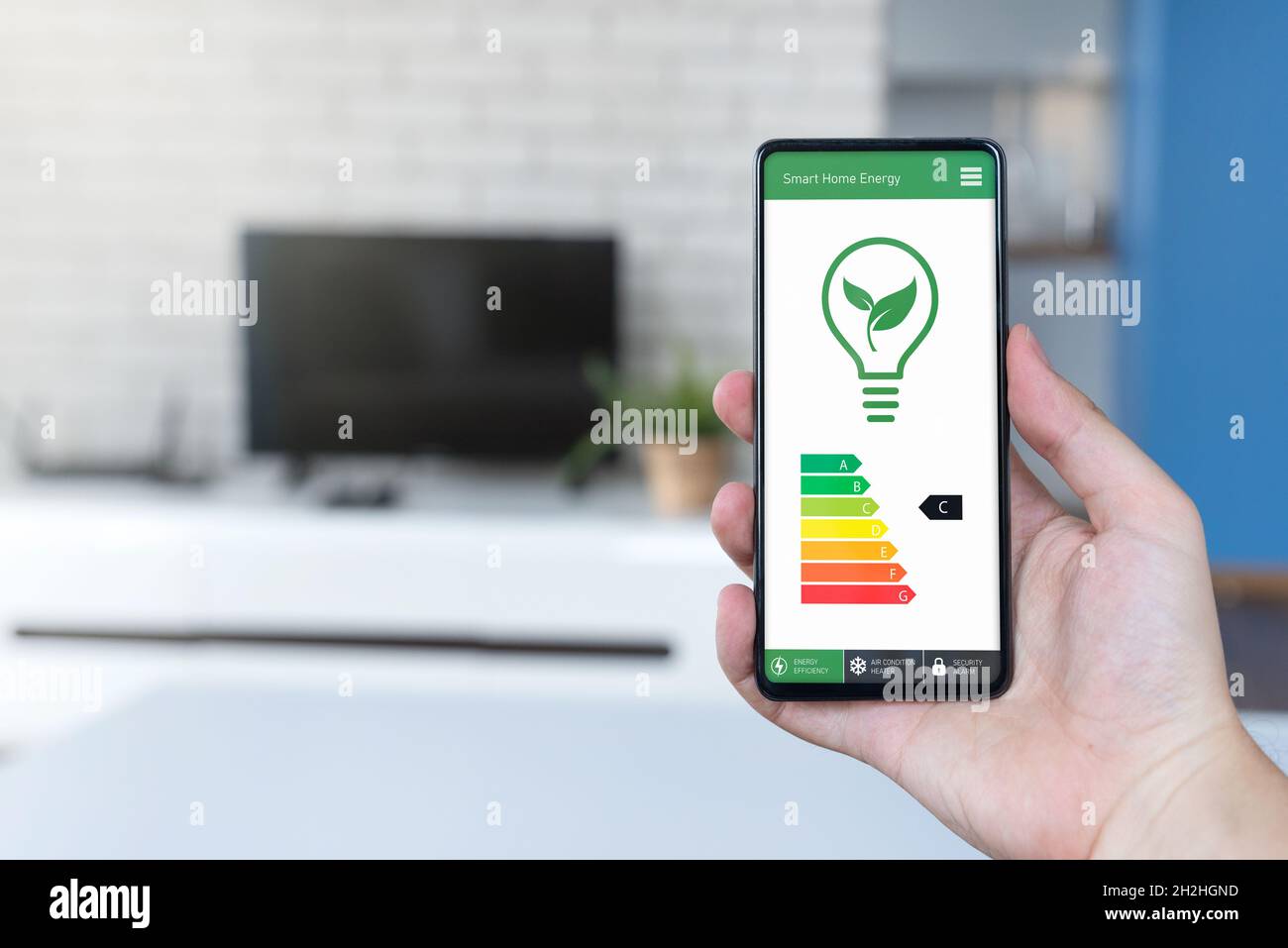 Energy efficiency mobile app on screen. Ecology, eco house concept ...