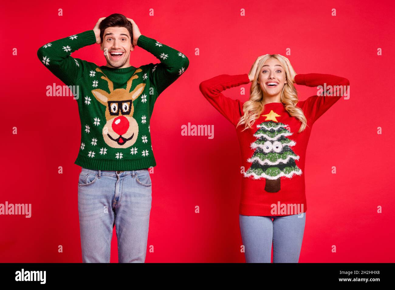Photo of amazed surprised funny couple omg reaction wear ugly sweater ...