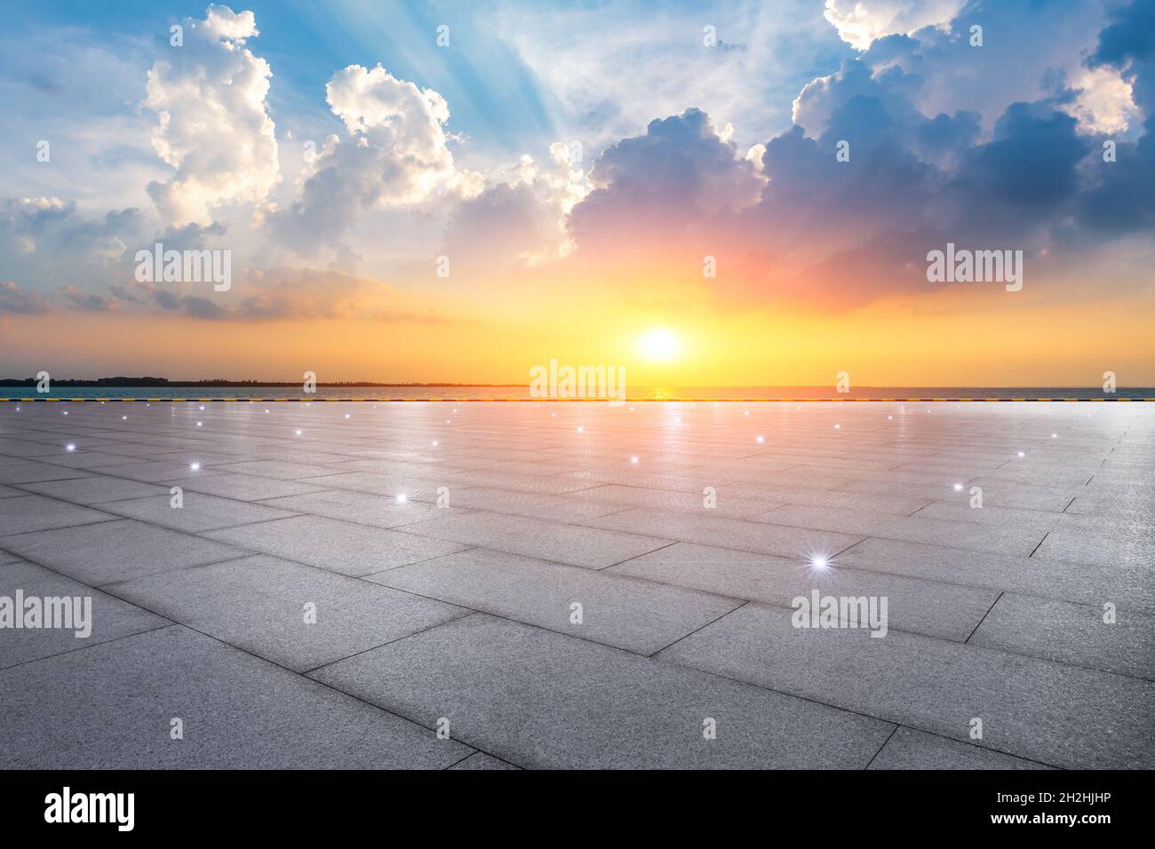 Empty square floor and lake with beautiful clouds at sunset Stock Photo ...