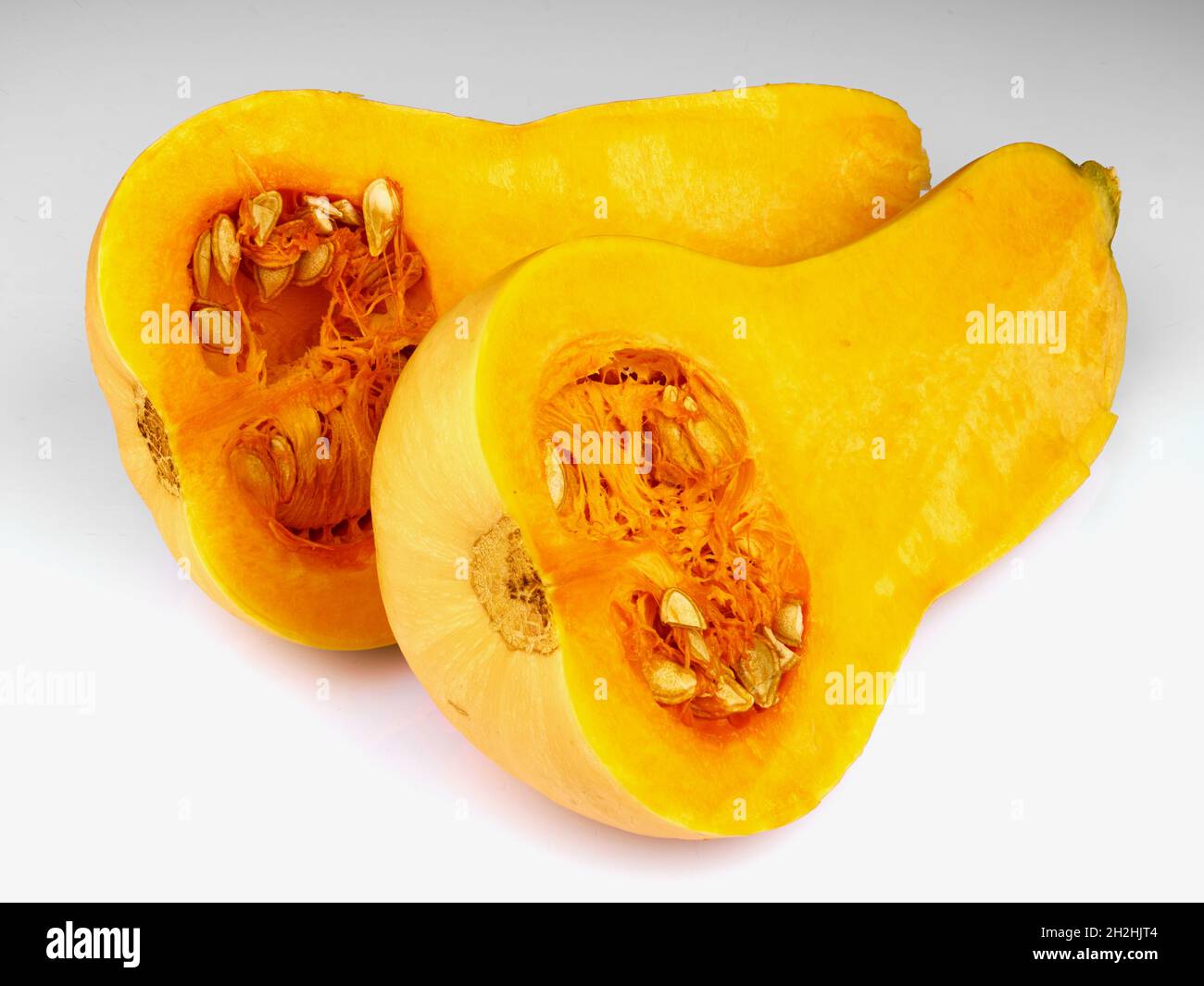 Butternut squash cut in half isolated on white background Stock Photo ...