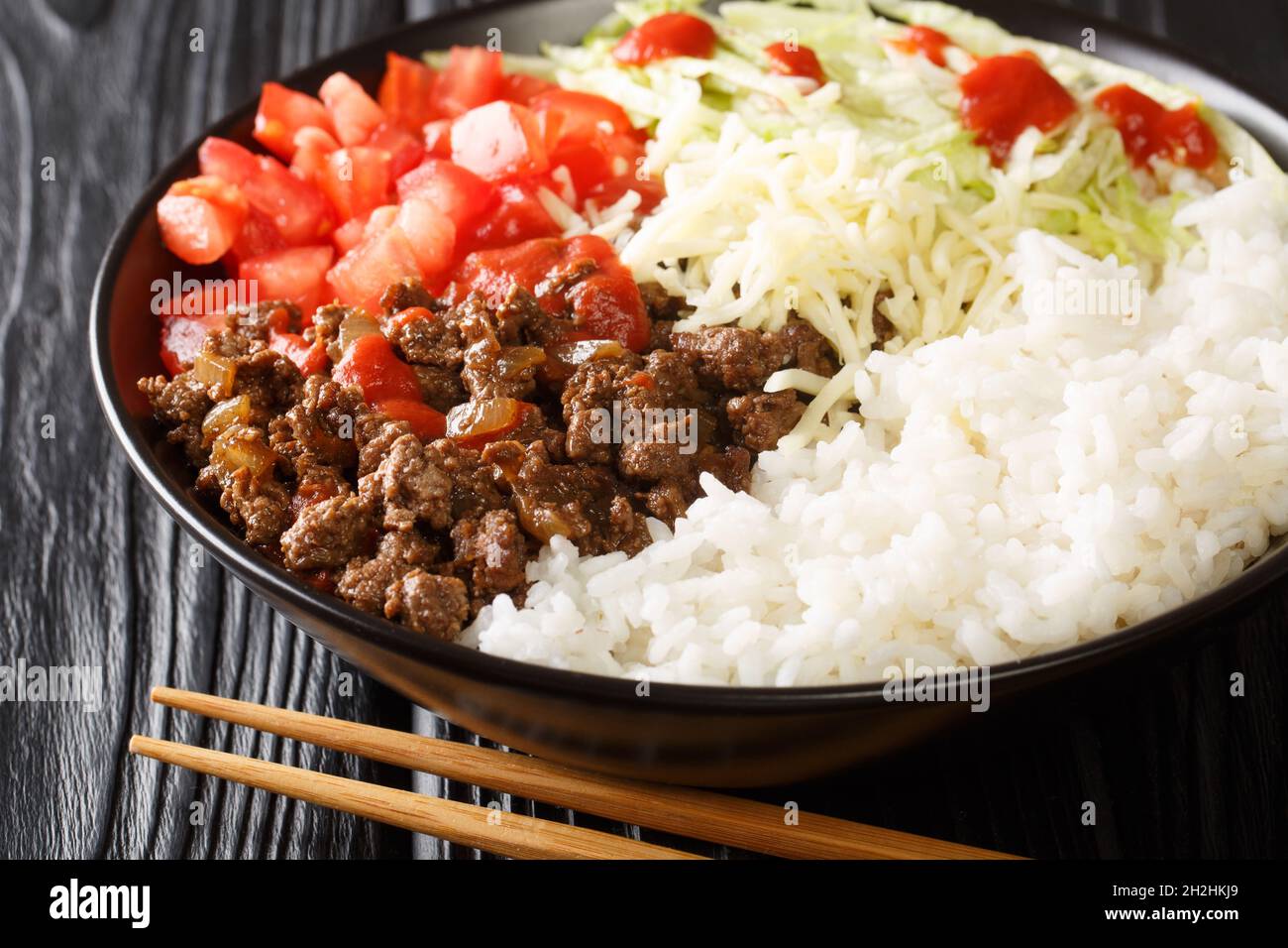 Taco rice takoraisu is a Mexican Japanese fusion dish consisting of ...