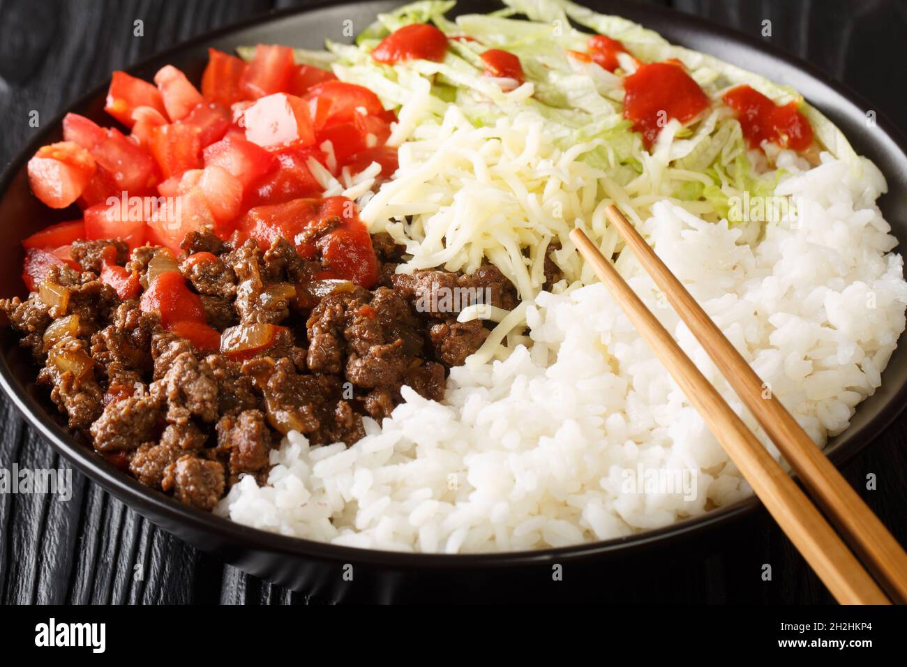 Takoraisu Taco rice is a Japanese dish hailing from Okinawa close-up in ...