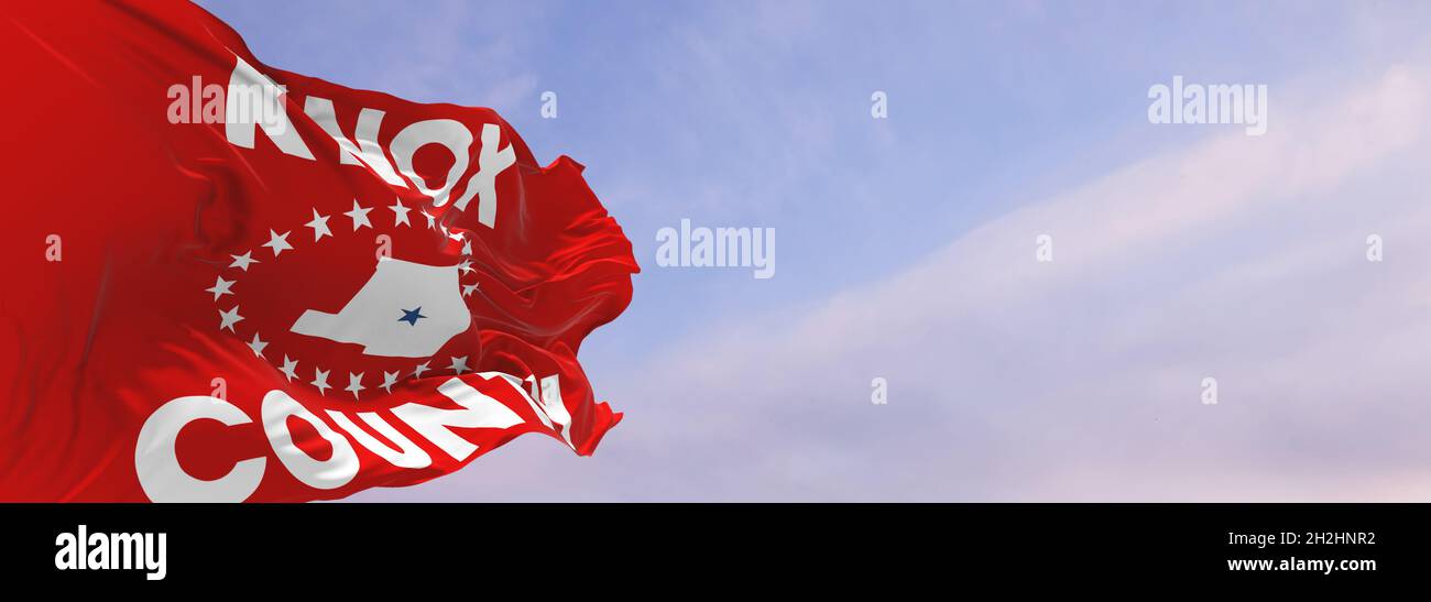 flag of county Knox, Ohio , USA at cloudy sky background on sunset ...