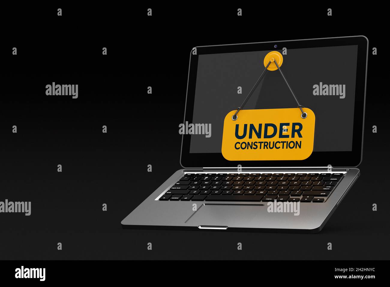 Modern Laptop with Yellow Under Construction Hanging Banner Sign on a ...