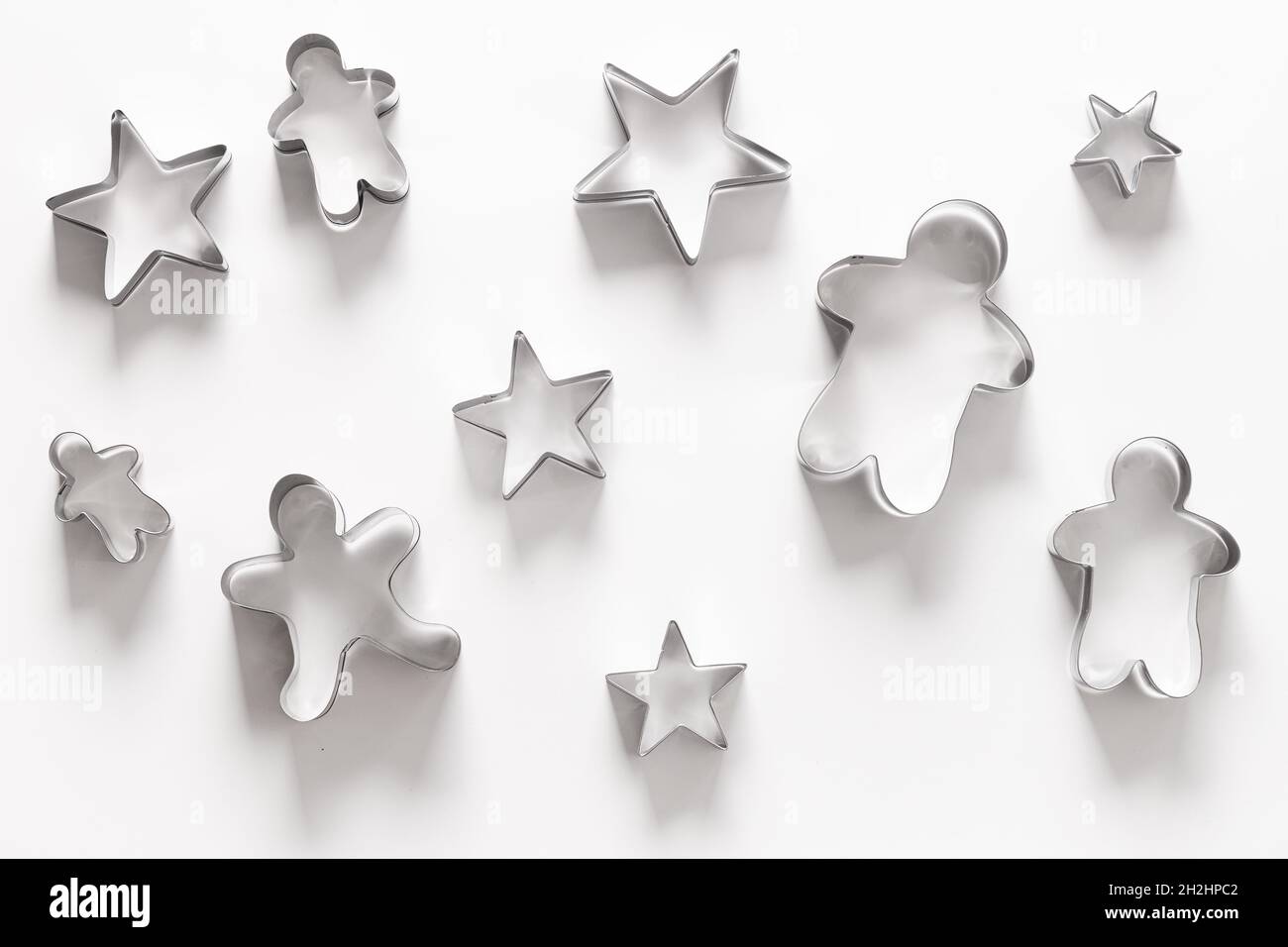 Christmas-themed cookie cutters for traditional gingerbread on white ...