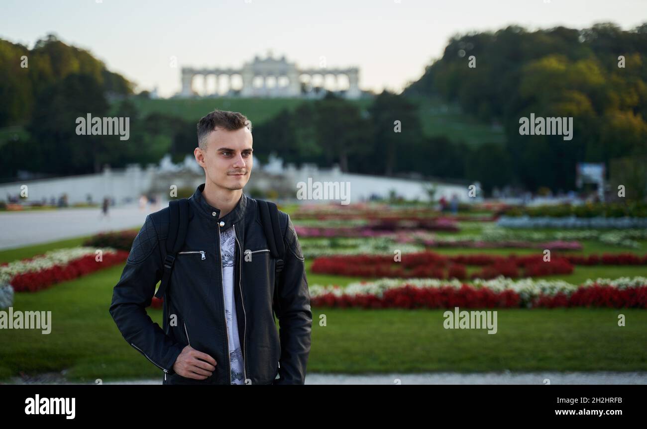Selective focus portrait of a handsome young man in urban environment ...