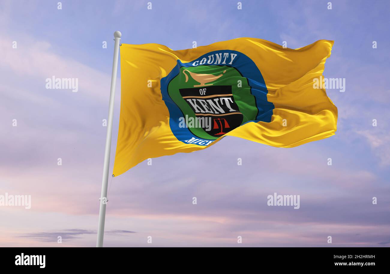 flag of county Kent, Michigan , USA at cloudy sky background on sunset ...