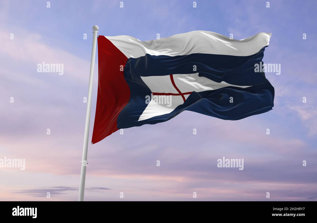 flag of county Lucas, Ohio , USA at cloudy sky background on sunset ...