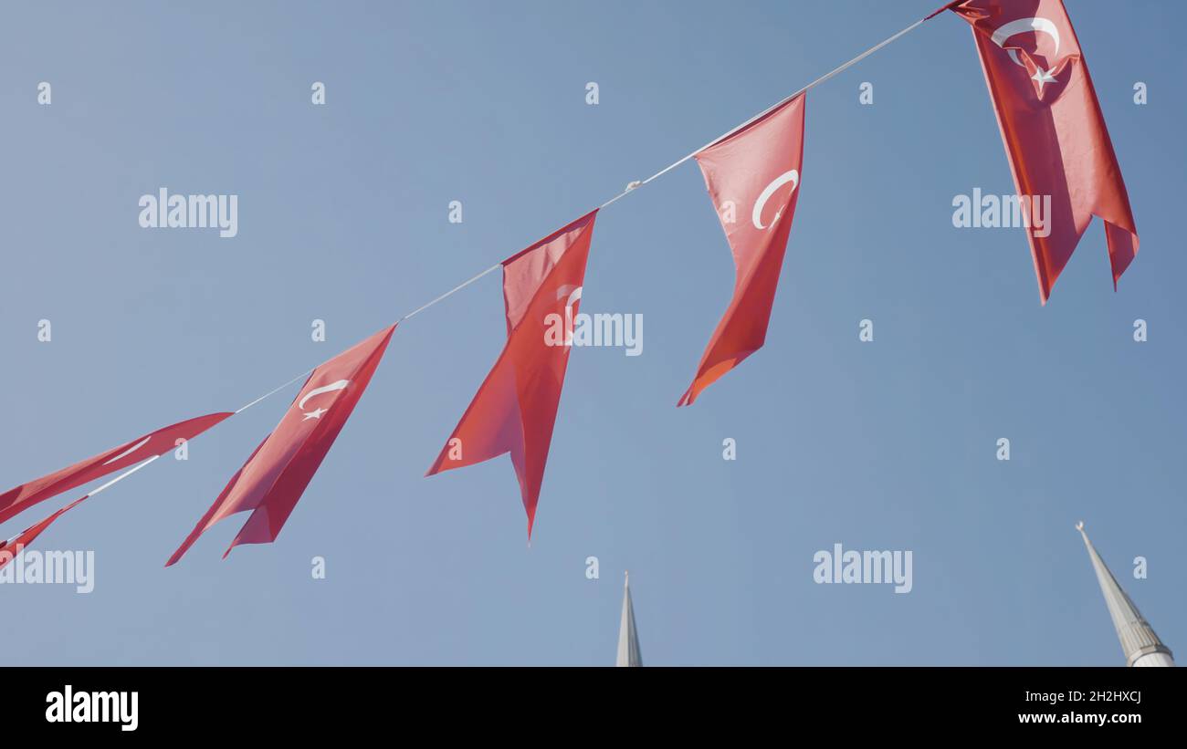 Turkish flags on rope. Action. Flags of Turkey are festively hung on ...