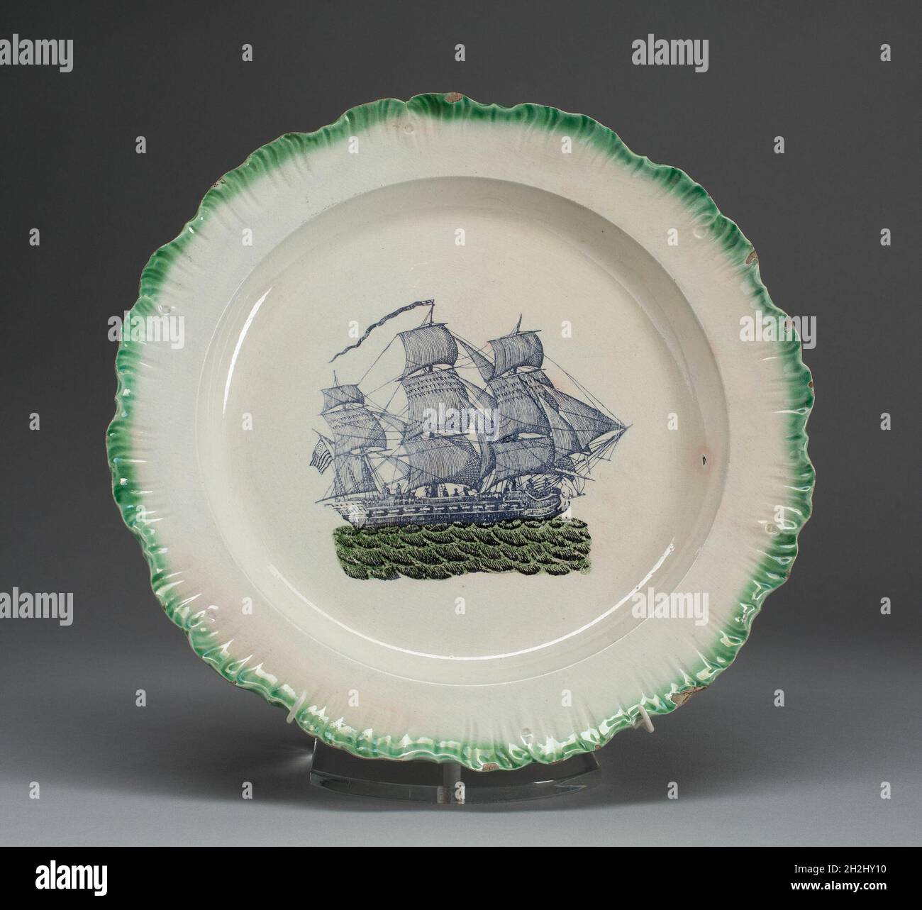 Plate, c. 1780/1810. Scalloped rim, with motif of sailing ship flying ...