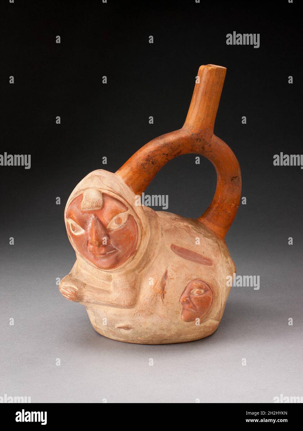Handle Spout Vessel in the Form of a Crouching Figure with Human Heads ...