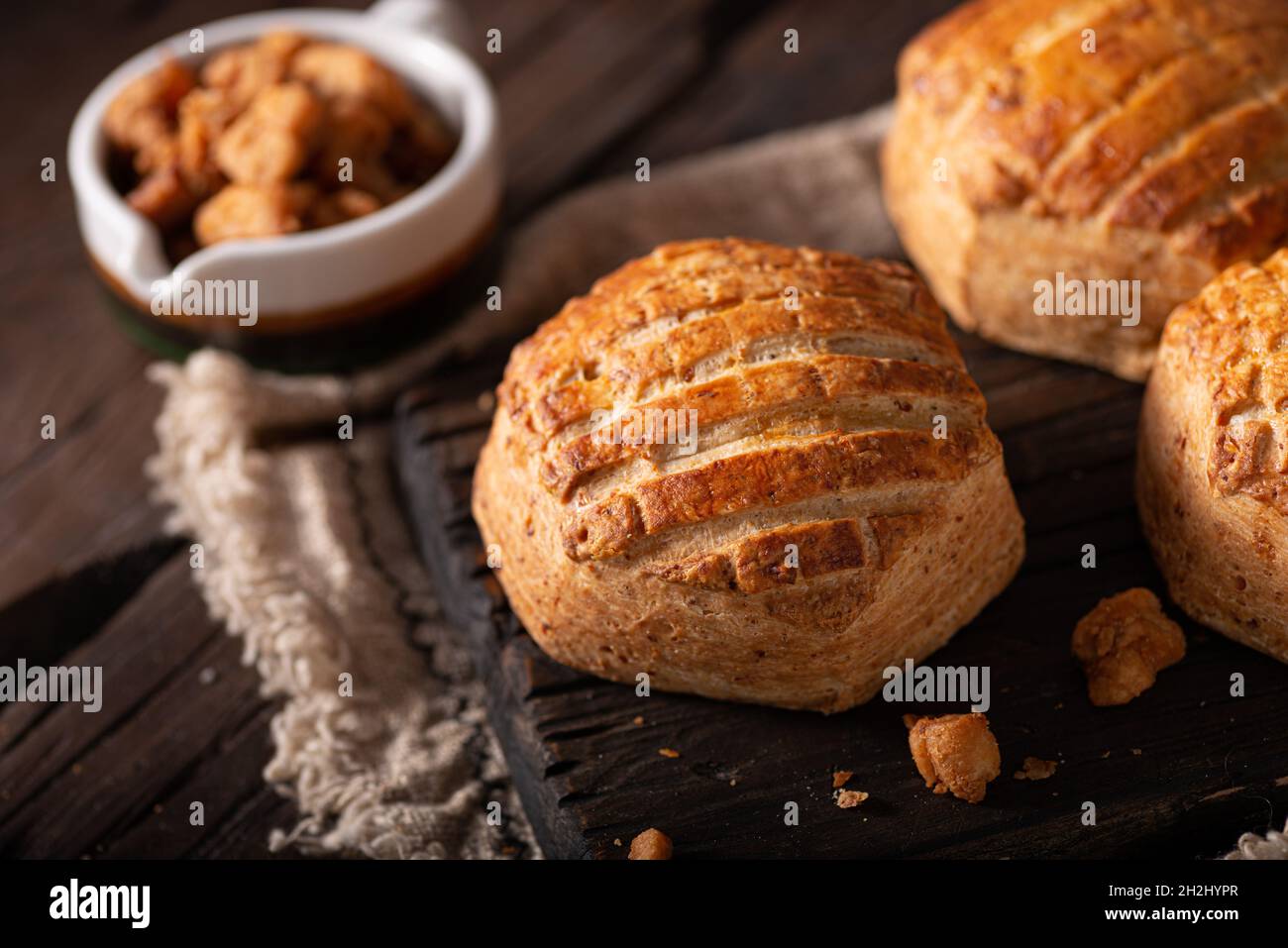 Delicious homeade bun filled with pork greaves and garlic Stock Photo ...