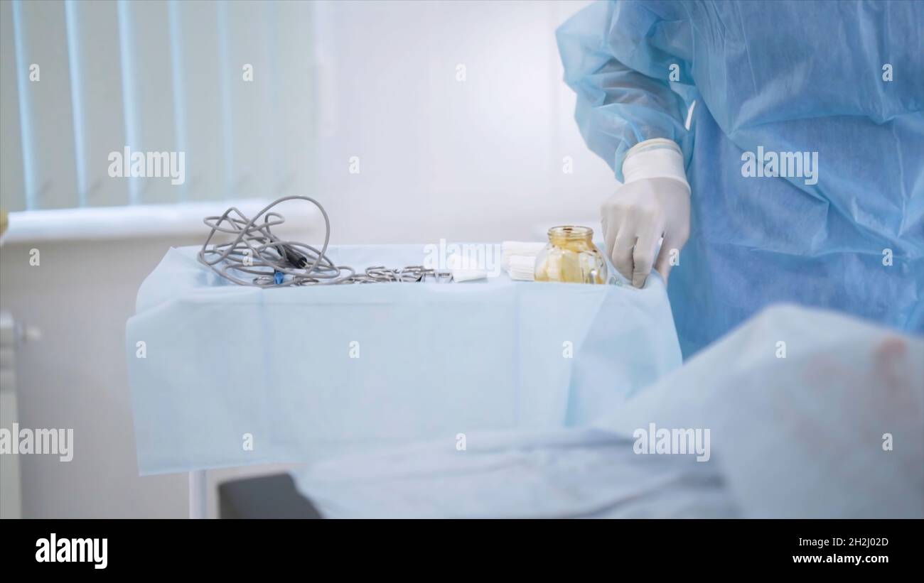 Close-up of surgeon taking scissors for surgery. Action. Surgical ...