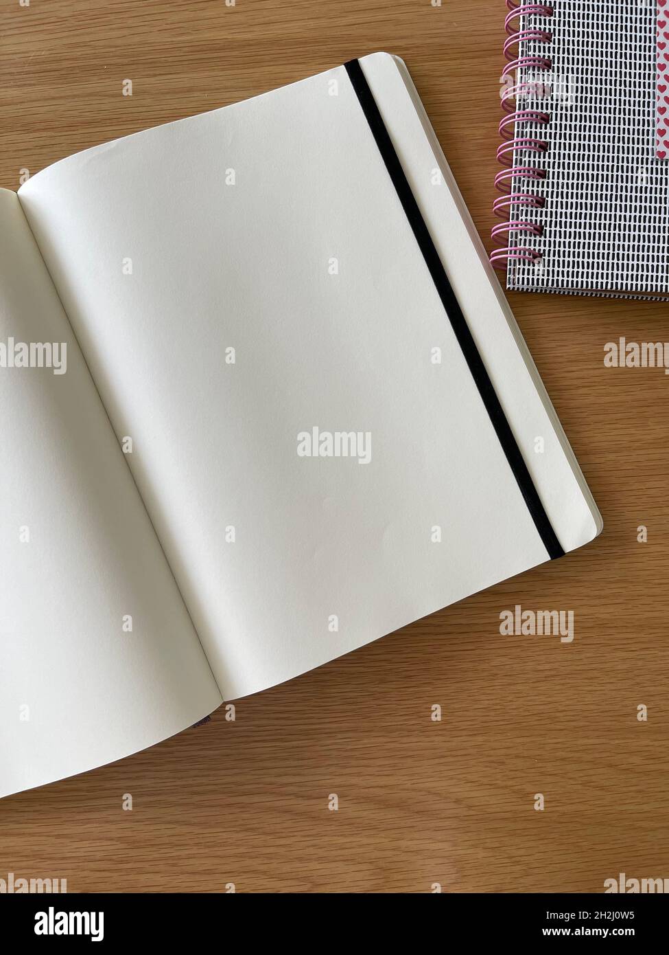 Vertical top view shot of notebook with blank pages on the desk Stock ...