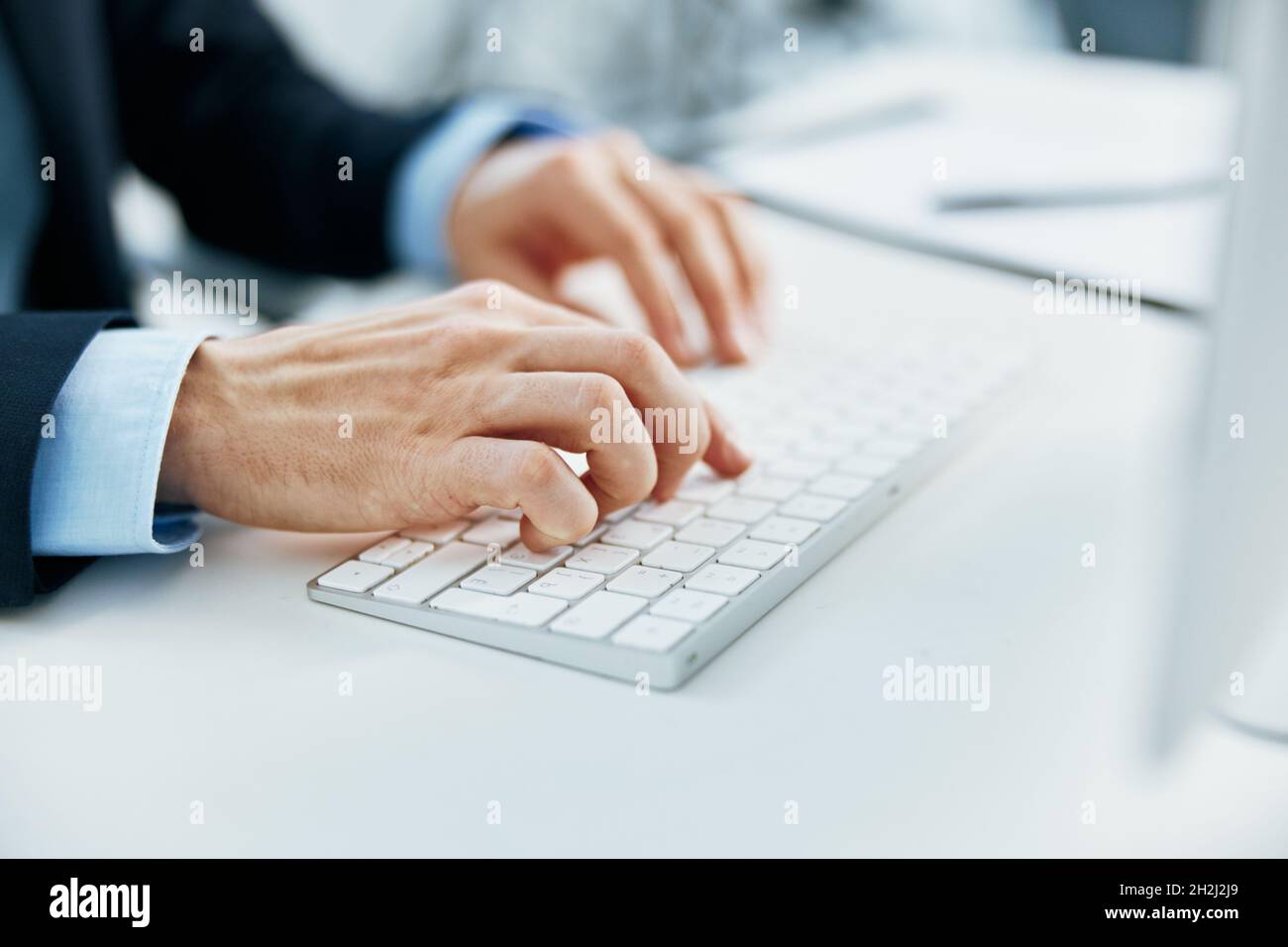 typing on the keyboard desktop Office manager Stock Photo - Alamy