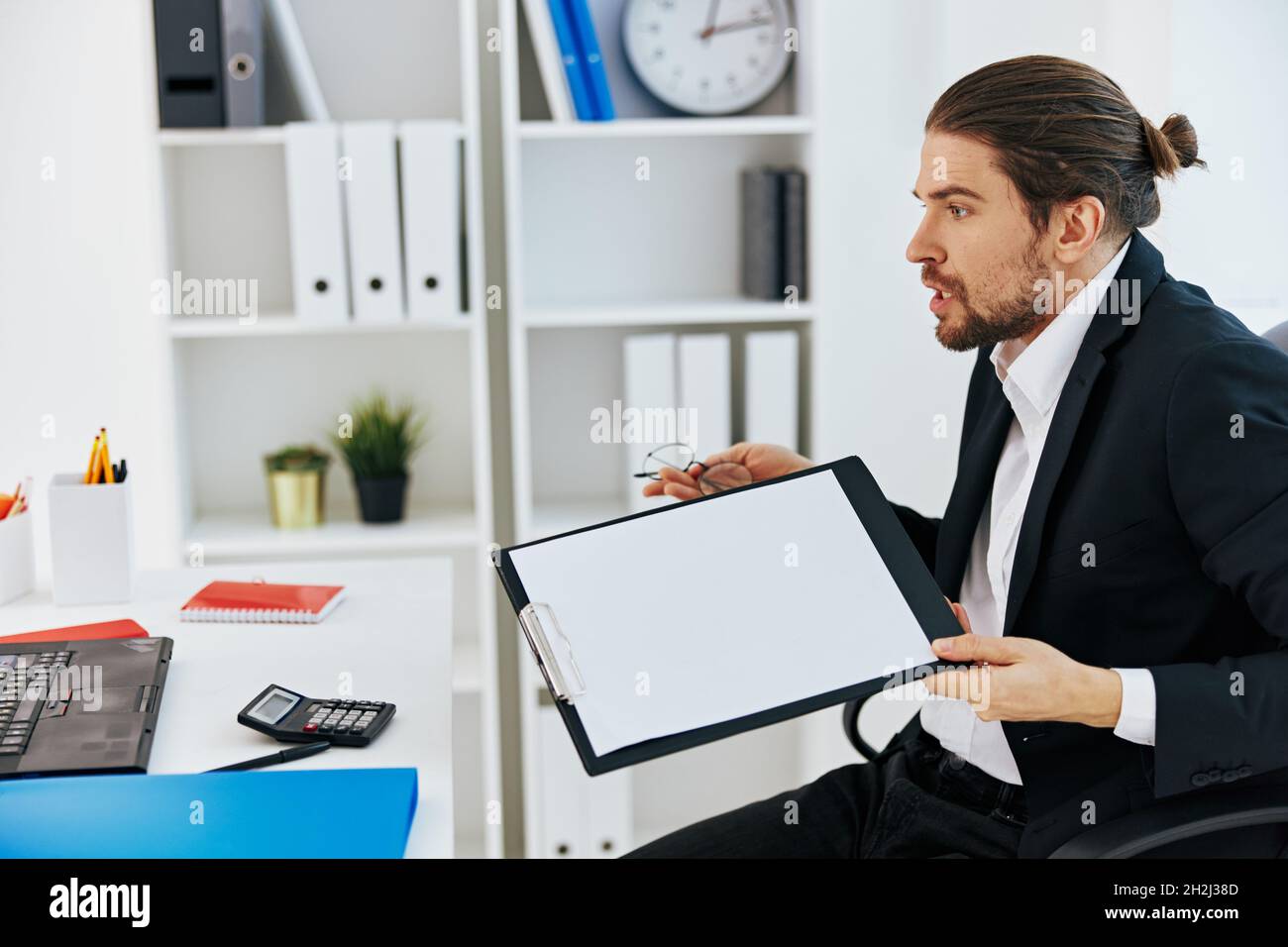 manager work in the office in front of a laptop technologies Stock ...