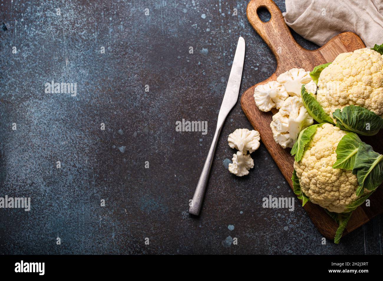 Fresh raw cut cauliflower with knife copy space Stock Photo - Alamy