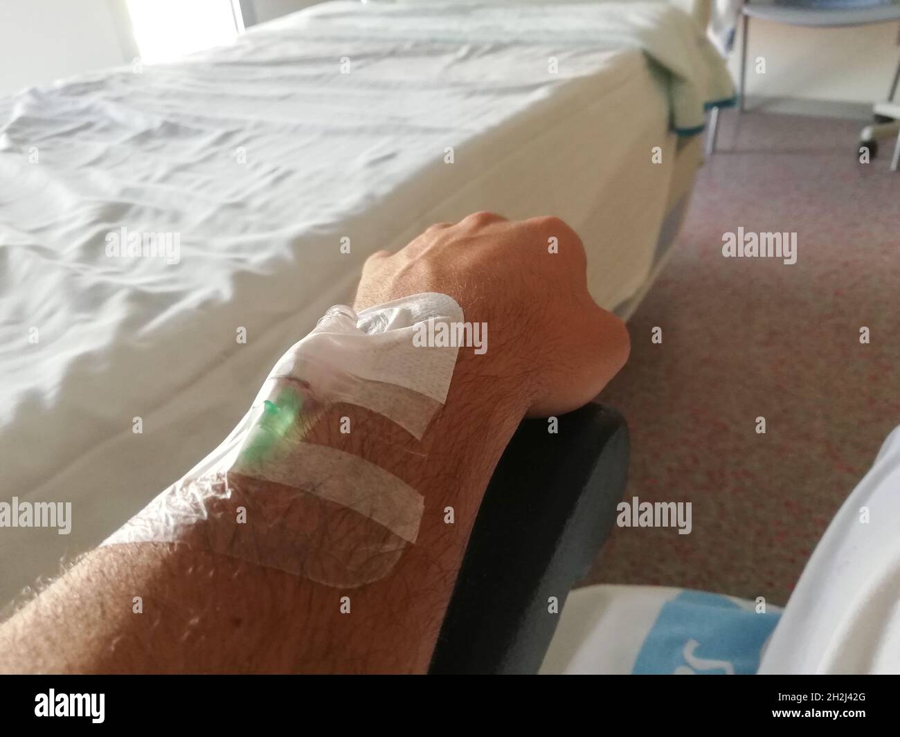 Arm of a patient with an IV line in the hospital Stock Photo - Alamy