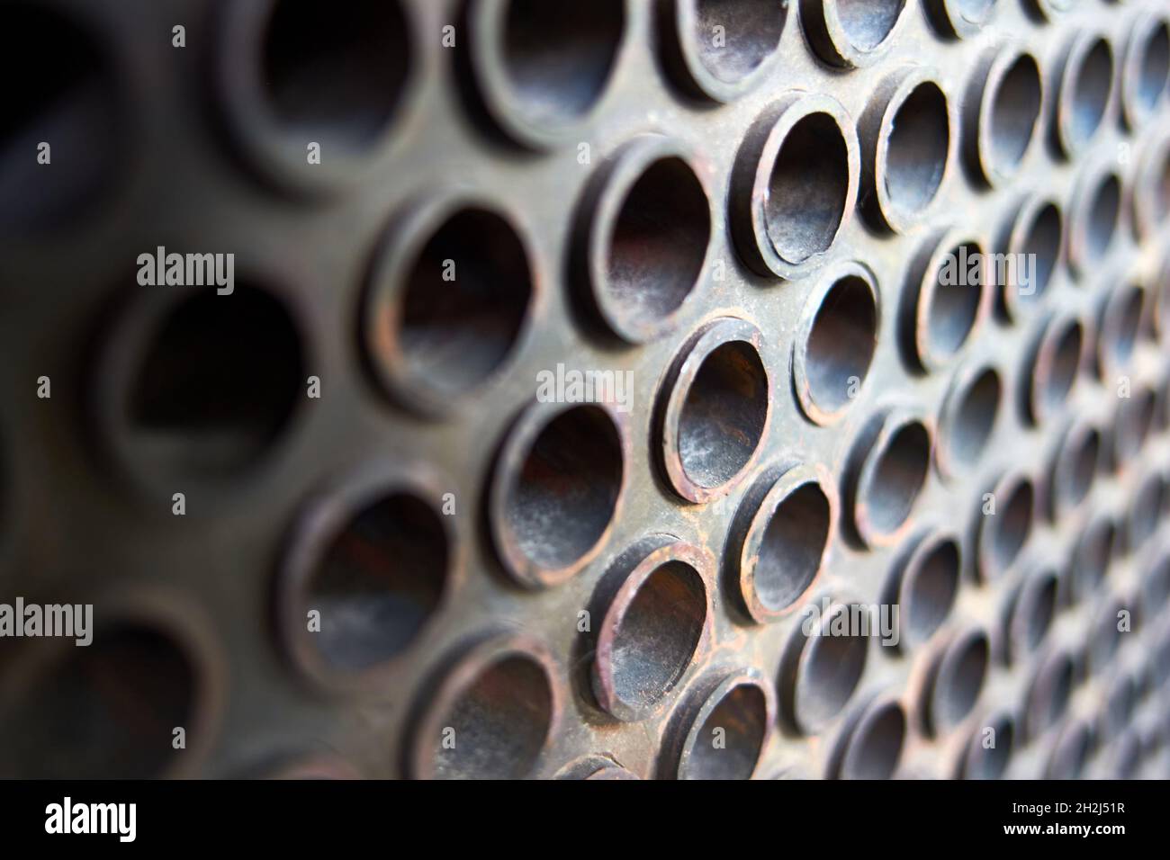 Tube sheet or plate of boiler or heat exchanger selective focus shot at ...