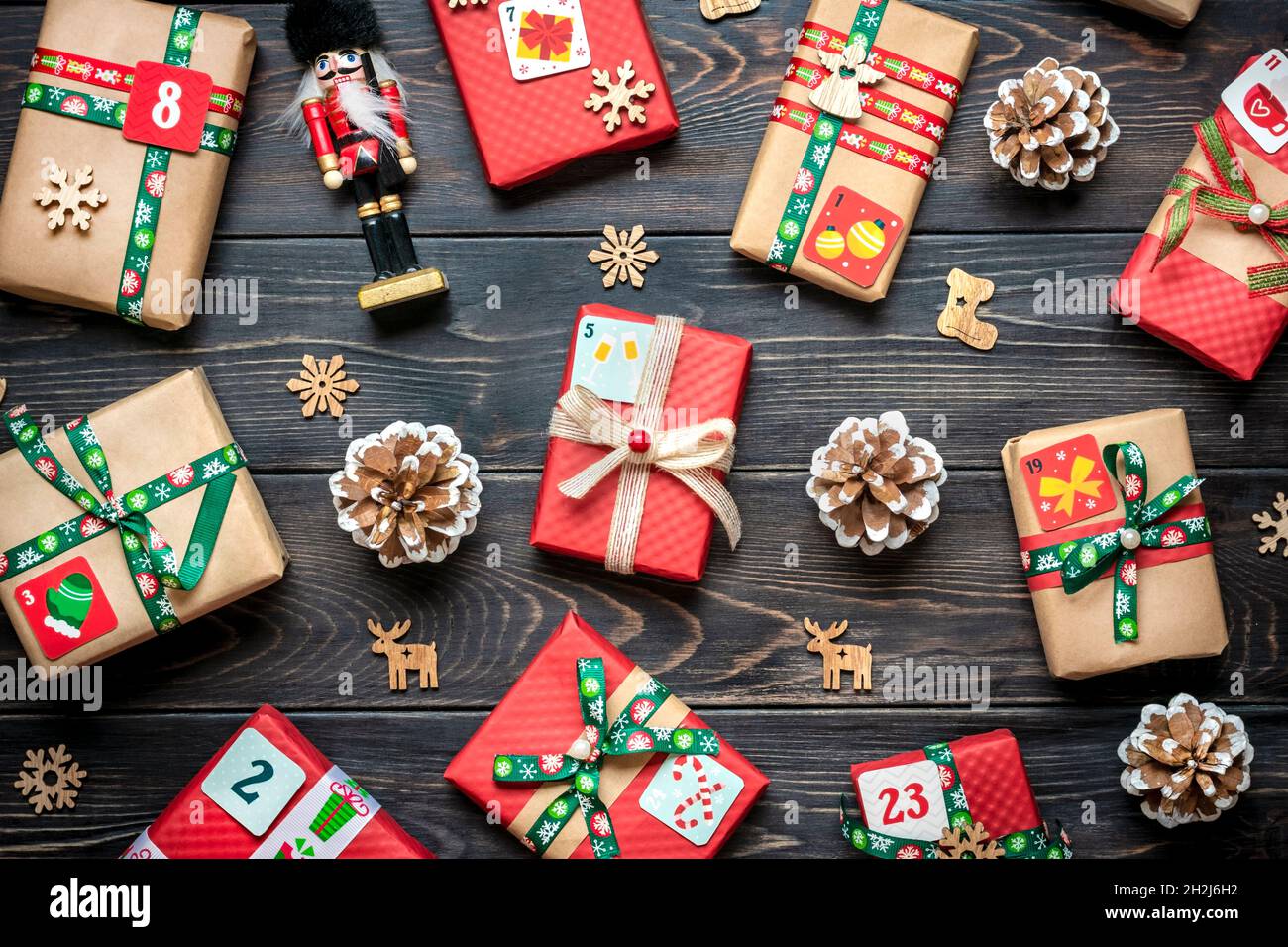 Handmade wrapped red, green gift boxes decorated with ribbons ...