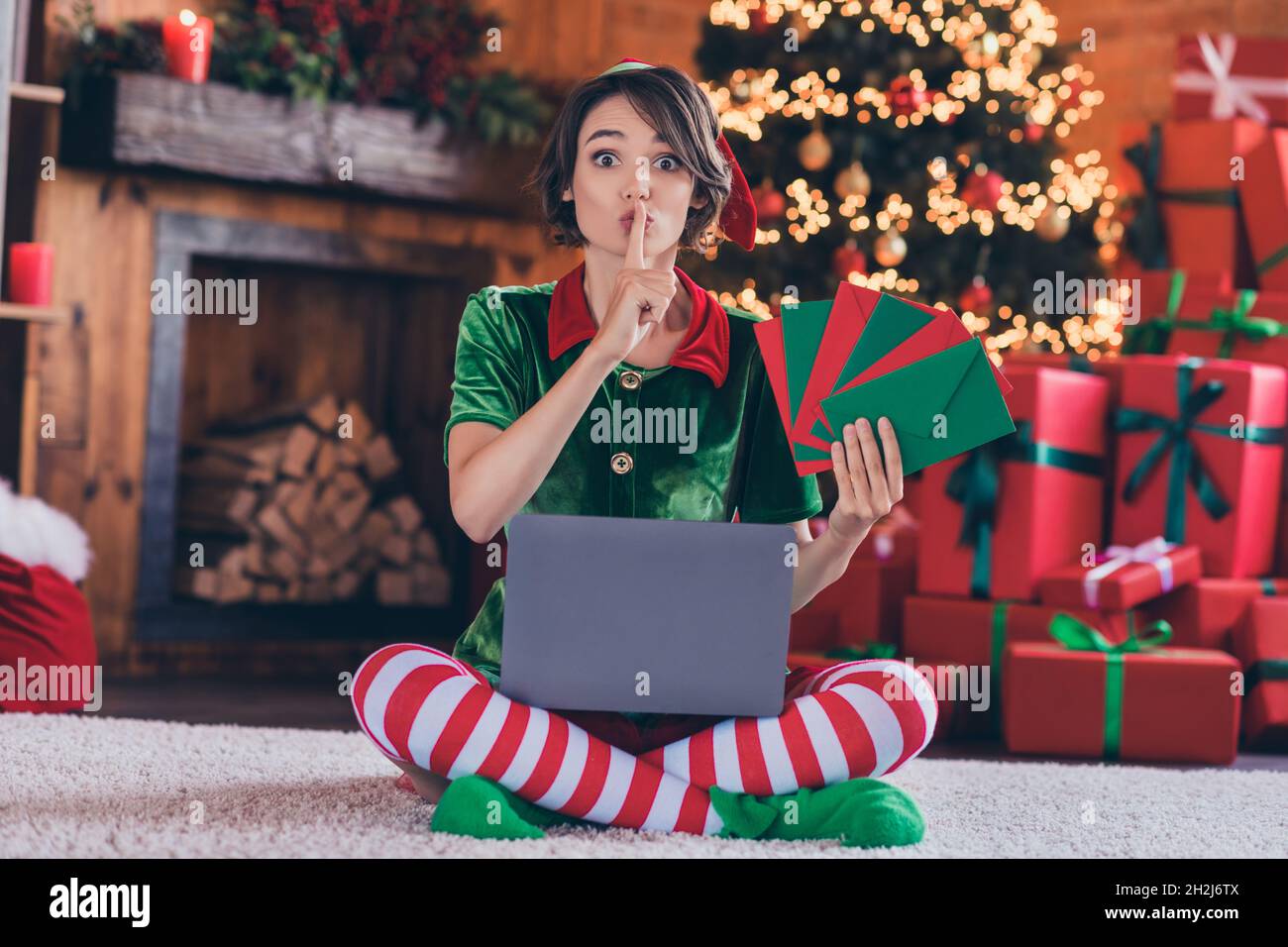 Portrait of attractive girl elf using laptop sending letters showing ...