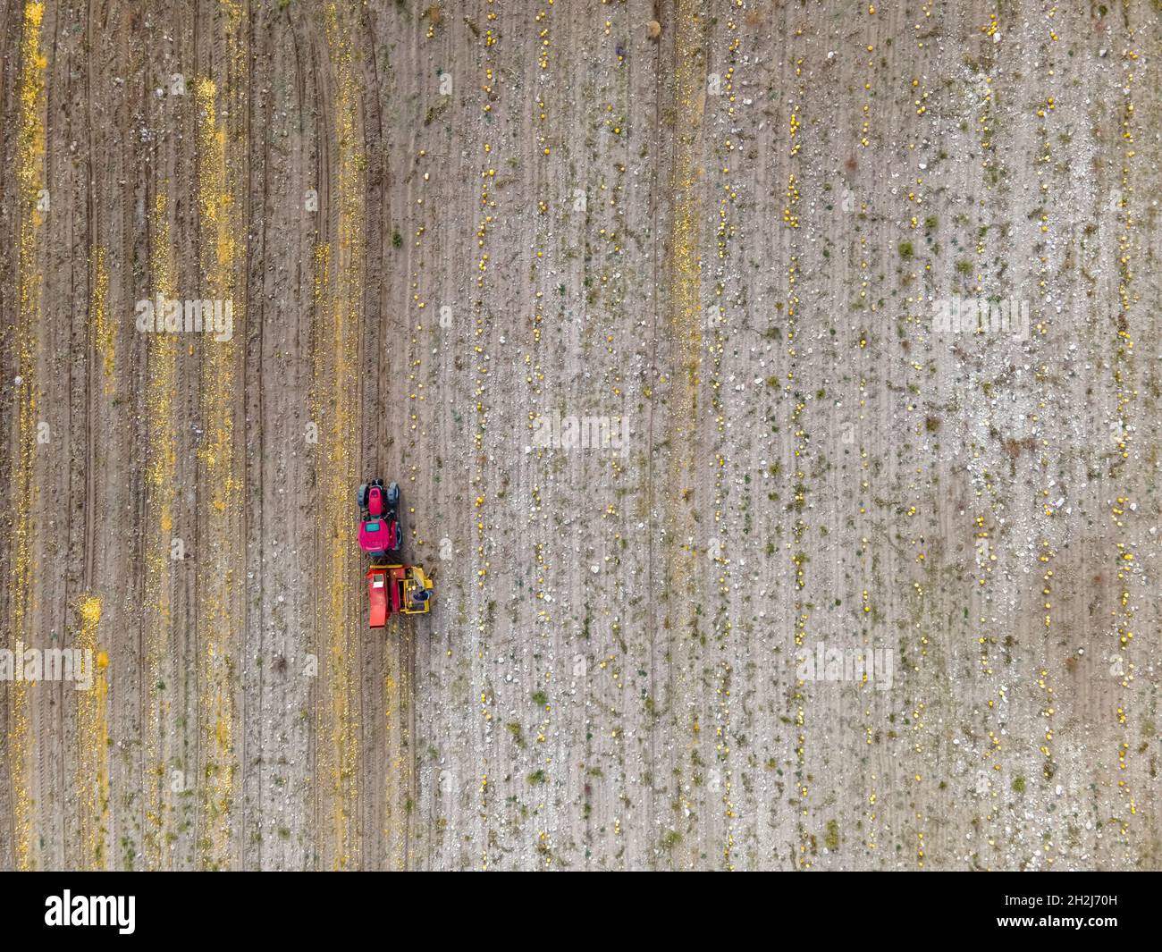 Aerial view of an industrial tractor working on land Stock Photo - Alamy